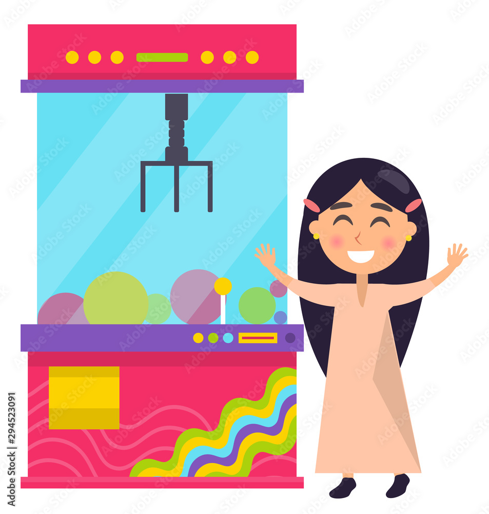 Young girl with long dark hair playing pink retro claw machine with ...