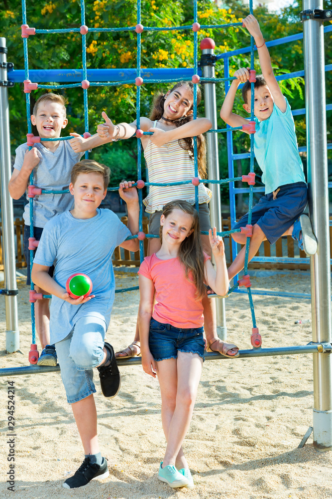 Happy children playing at playground Stock Photo | Adobe Stock