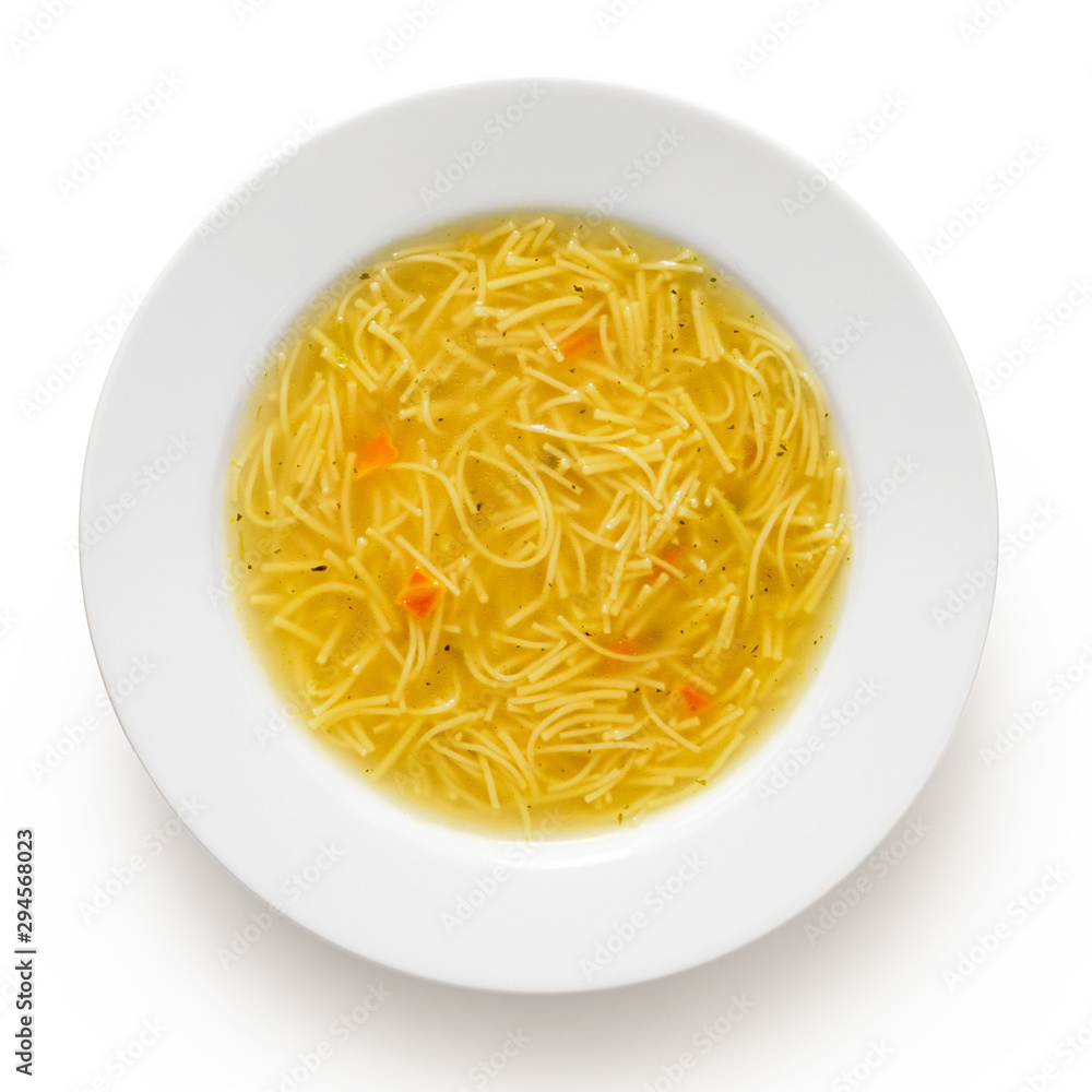 Instant chicken noodle soup in a white ceramic soup plate isolated on ...