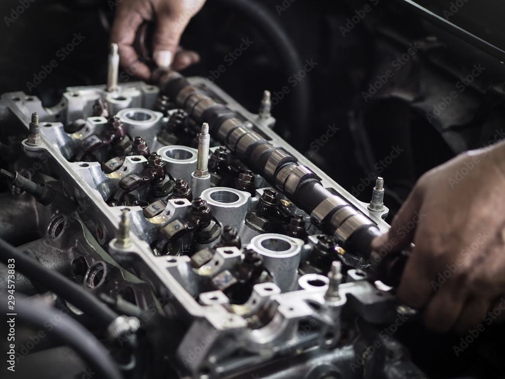 The head of cylinders removed from the engine for repair. Put the part ...