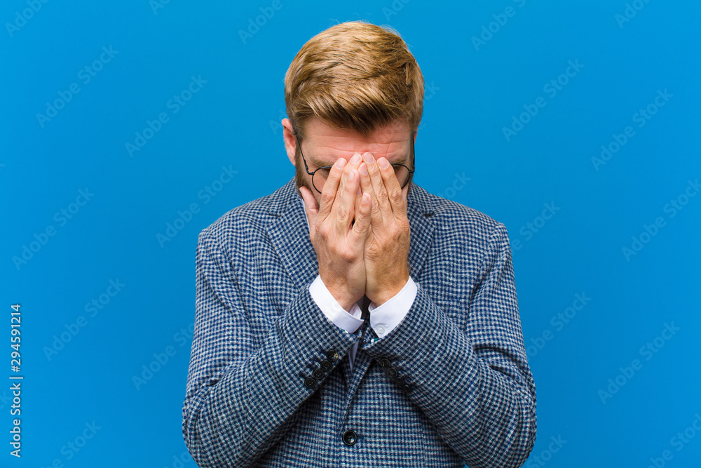 feeling sad, frustrated, nervous and depressed, covering face with both ...