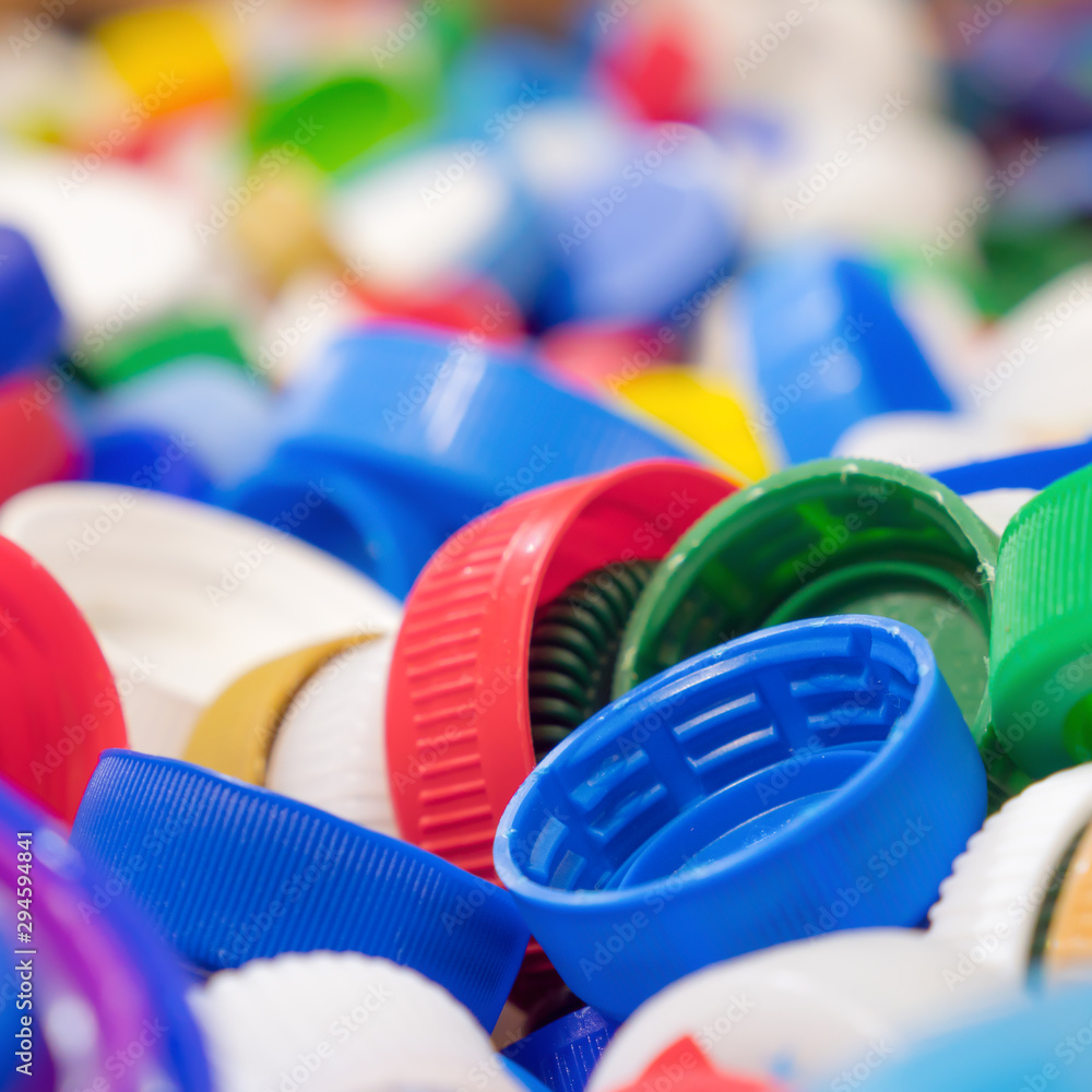 Plastic bottle caps of different colors. Background of lots of plastic ...