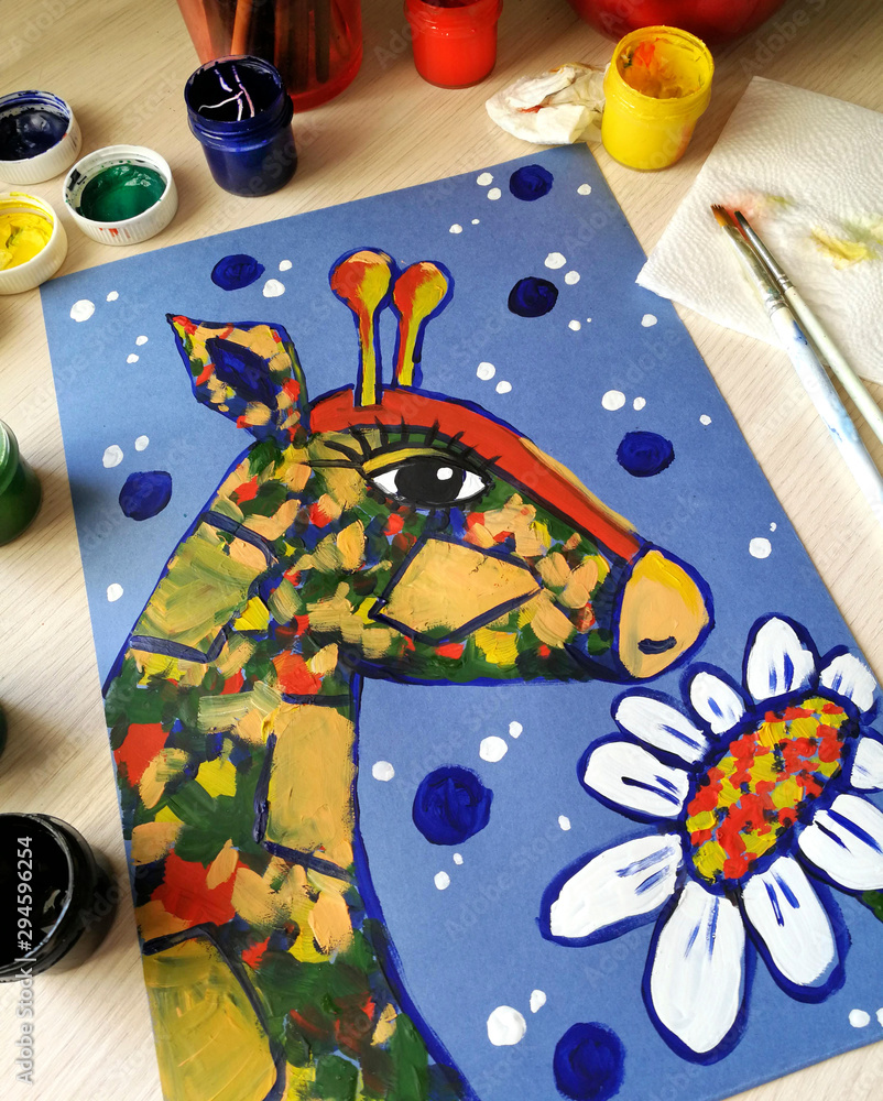 Giraffe drawing in gouache. A close-up photograph depicting a creative ...