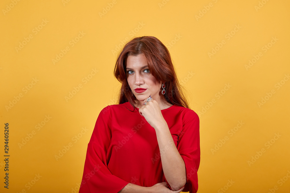 Peaceful woman propped chin on her left hand. This gesture shows that ...
