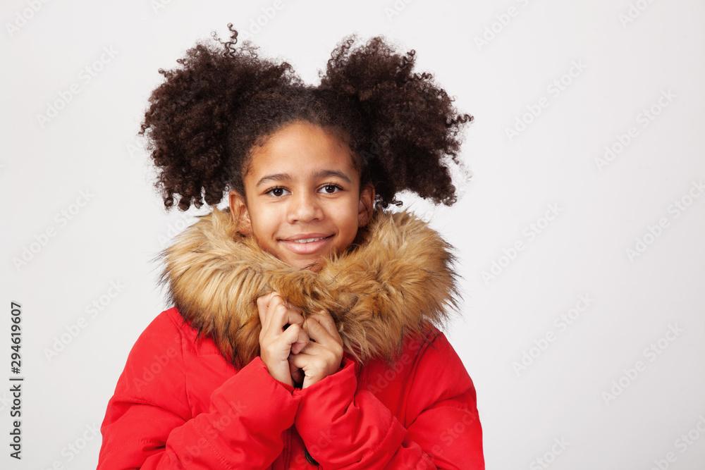 Cute teenage girl in red winter parka Stock Photo | Adobe Stock