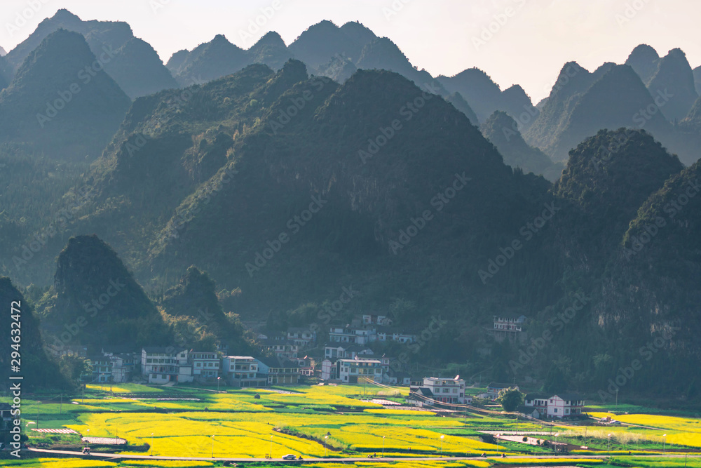Rapeseed flower field and villages at Wanfenglin National Geological ...