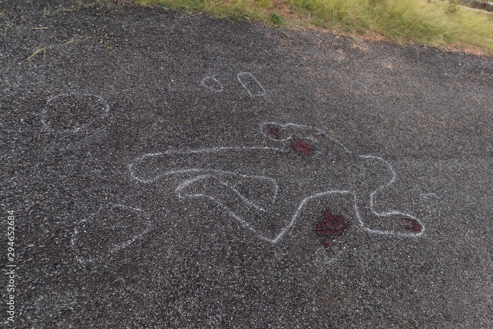 Crime scene chalk outline of victim dead body on Road with blood ...