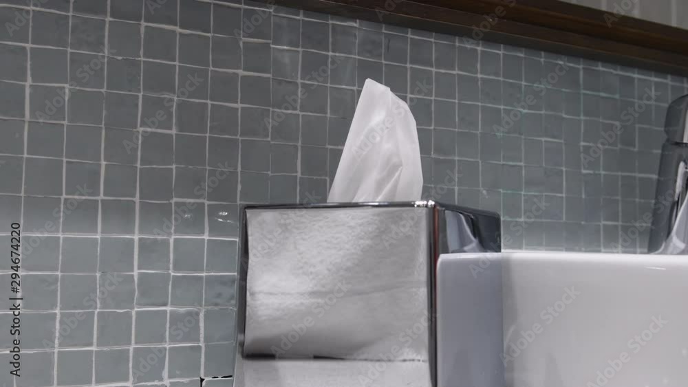 4K video of tissue box with white tissue protruding, Caucasian young to ...