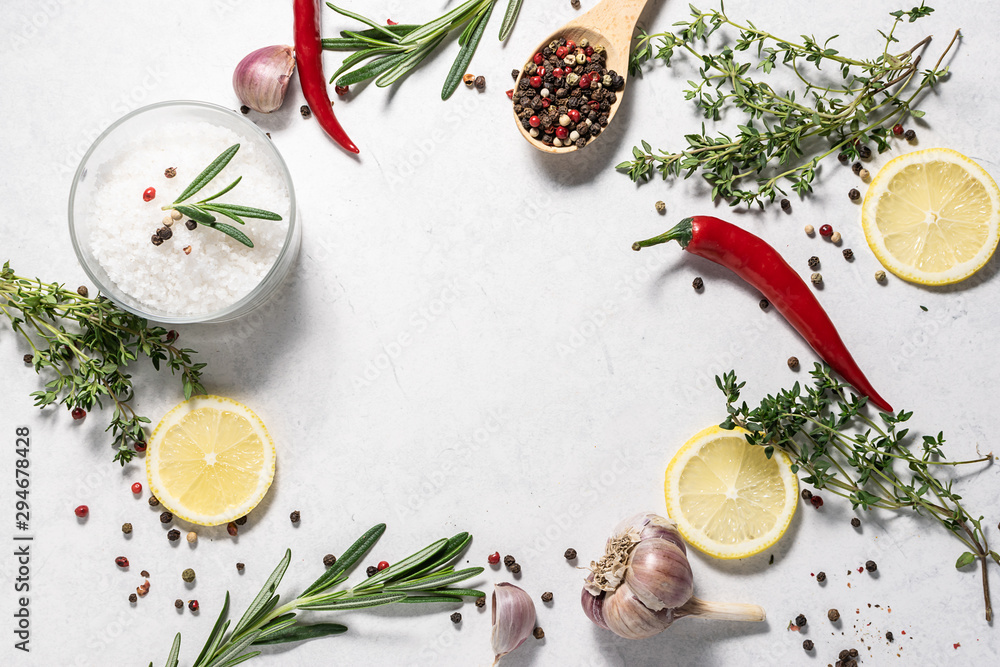 Colorful aromatic spices and herbs on white marble background. Template ...