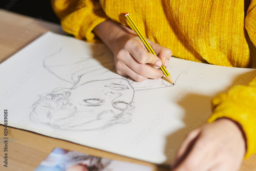 Crop woman drawing person in album Stock Photo | Adobe Stock