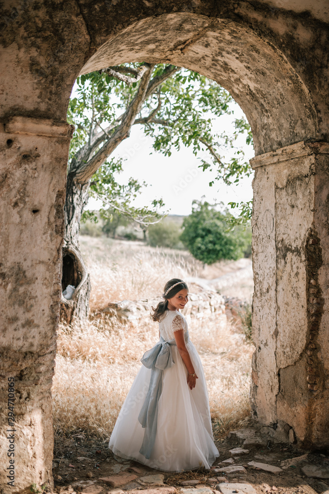 Little girl in communion dress in n old convent in ruins Stock Photo ...