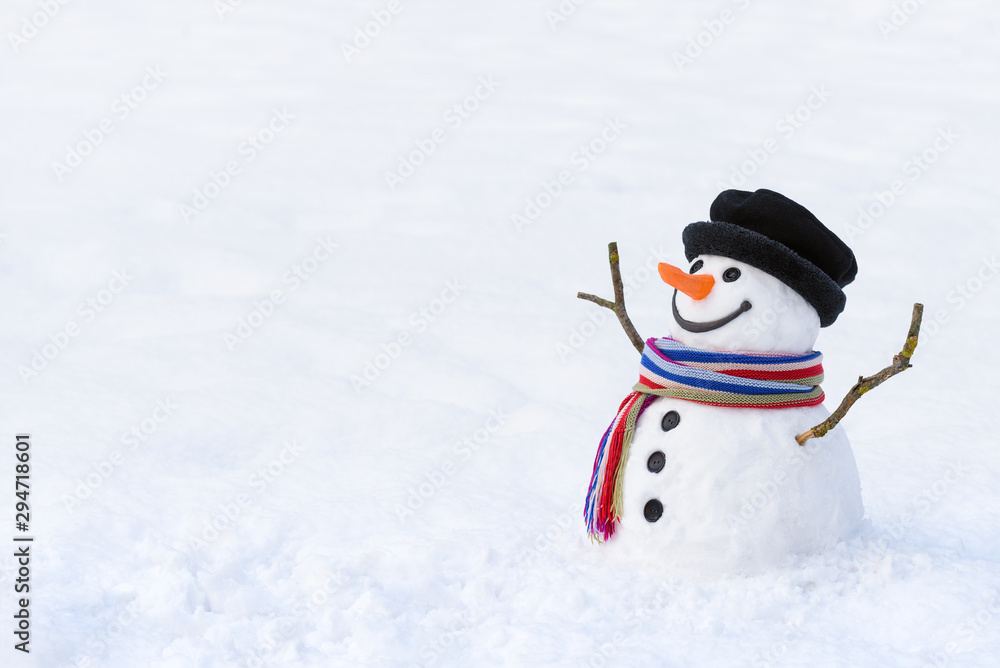 Cute snowman in deep snow Stock Photo | Adobe Stock