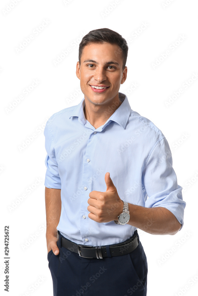 Portrait of handsome young businessman showing thumb-up on white ...