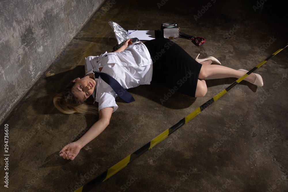 Crime scene imitation. Dead woman police officer lying on a floor ...