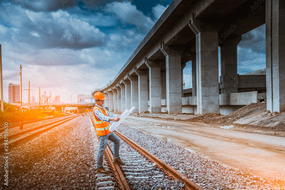 A engineer under inspection and checking construction process railway ...