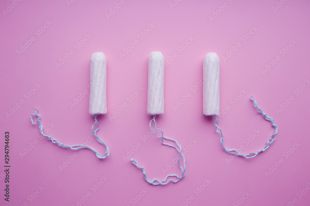 Medical female tampons on a pink background. White tampon for women ...