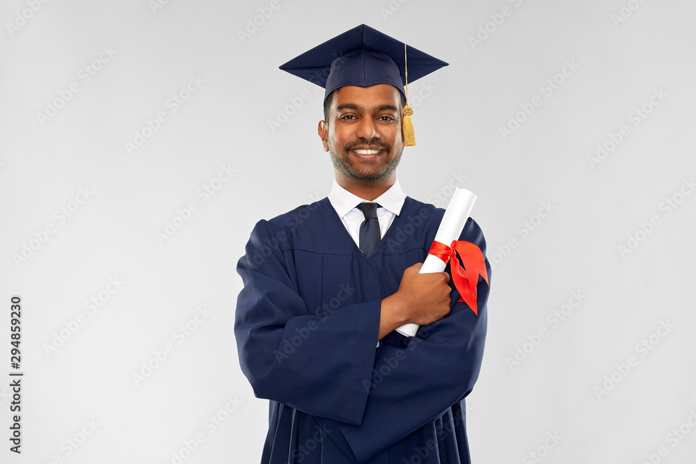 education, graduation and people concept - happy smiling indian male ...