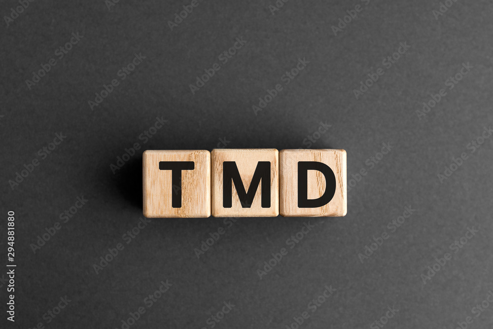 TMD - acronym from wooden blocks with letters, abbreviation TMJ ...