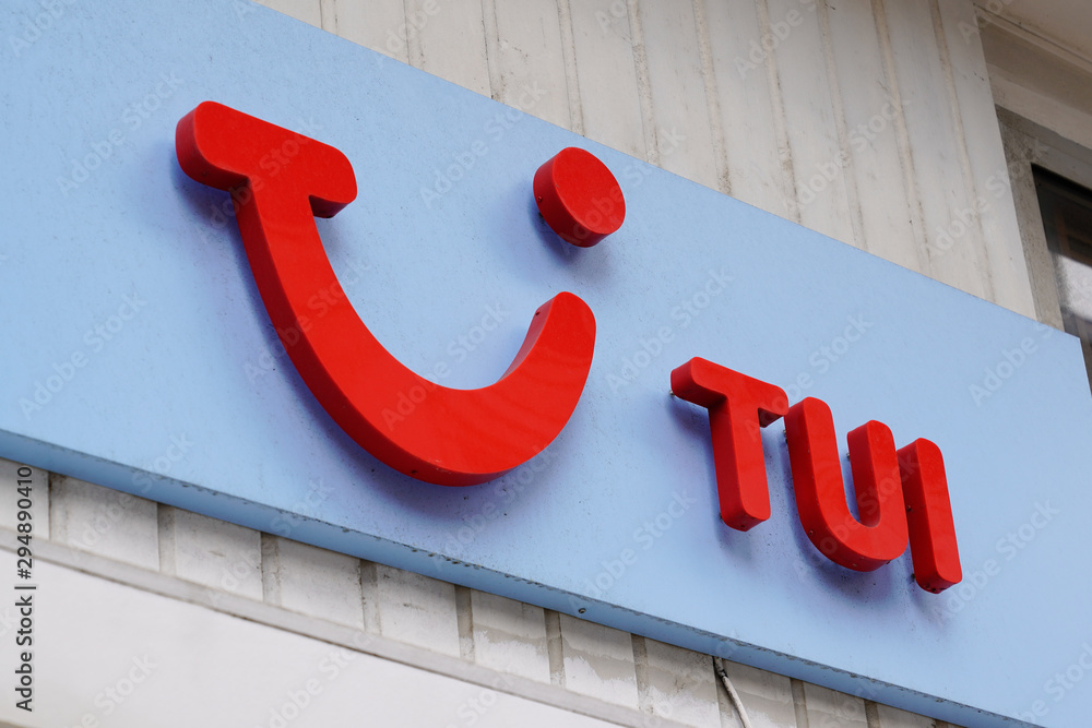 Tui logo on store wall sign office german travel agency Stock Photo ...
