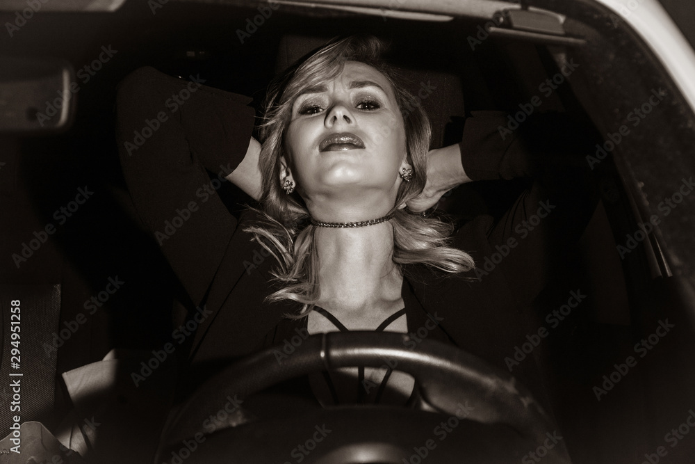 Scene from a detective series. Killer strangles business woman in her ...