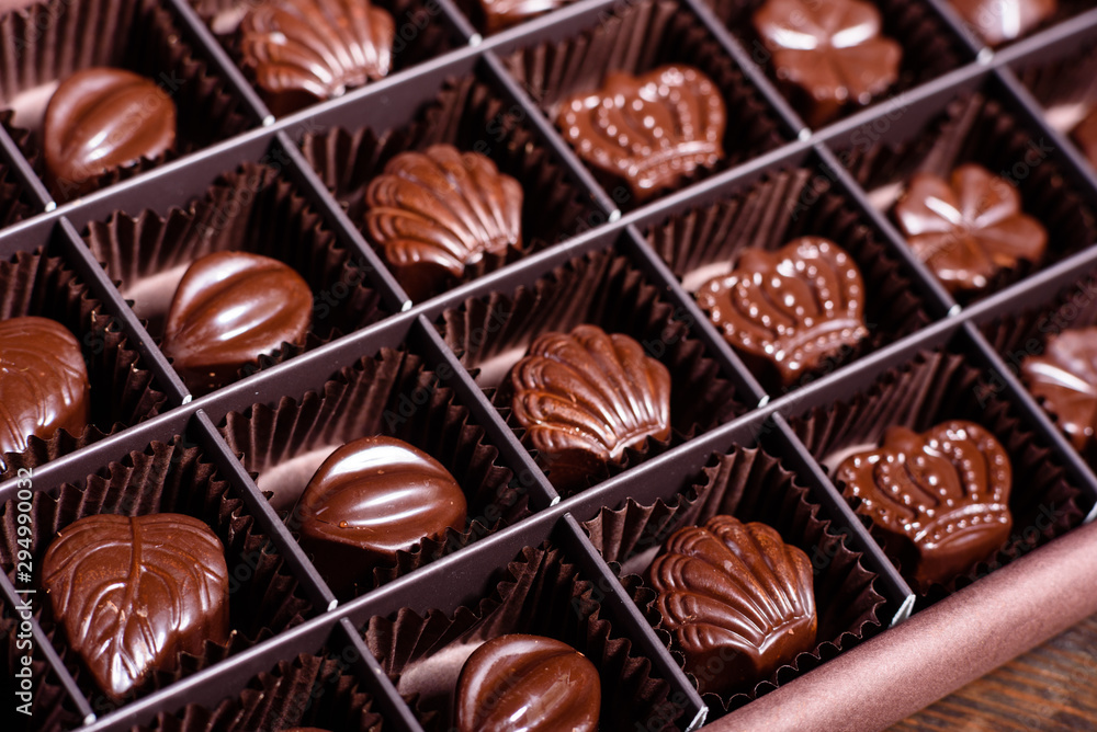 Assortment of fine chocolate candies, white, dark, and milk chocolate ...