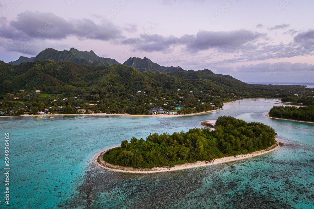 Aerial view of the sunrise over the stunning Muri lagoon and beach in ...