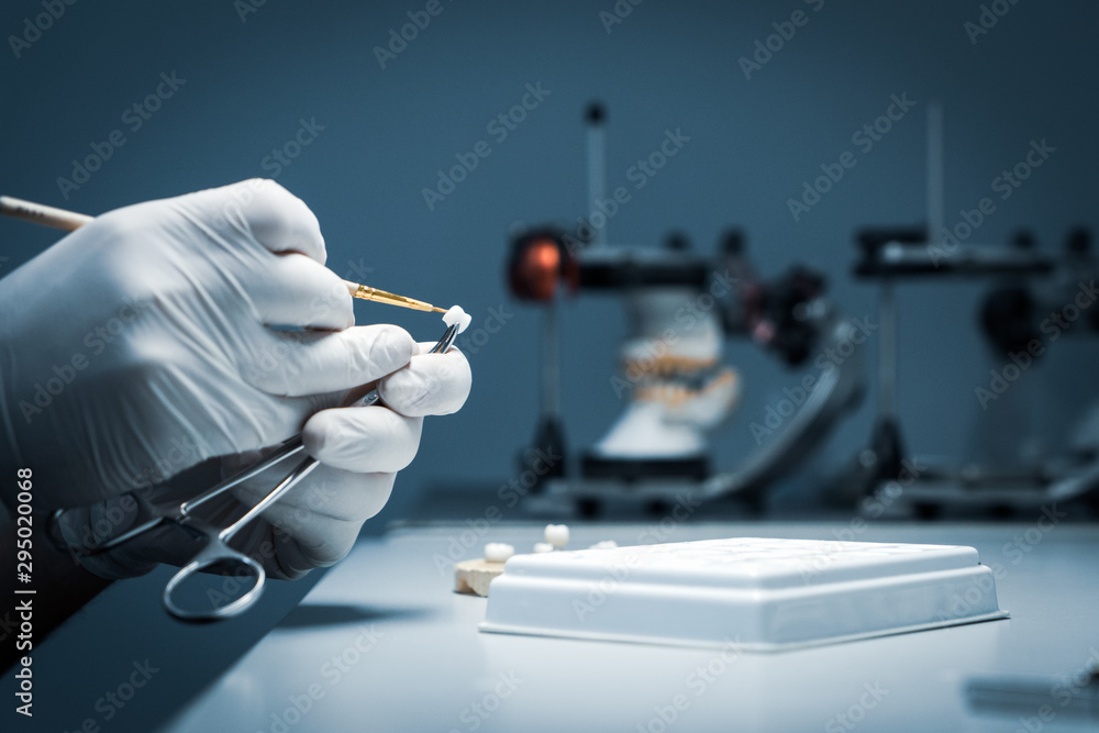 processing and correction of the dental crown. laboratory Stock Photo ...