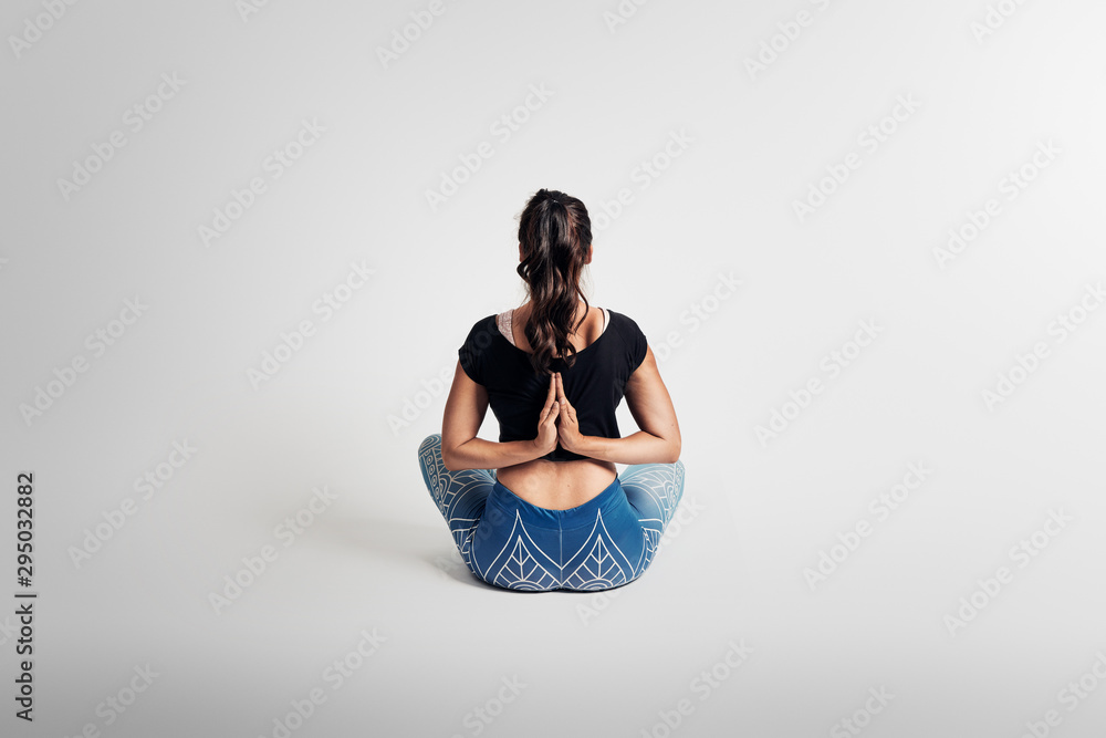 Yoga sitting pose from behind, stretching, woman on white backgroung ...