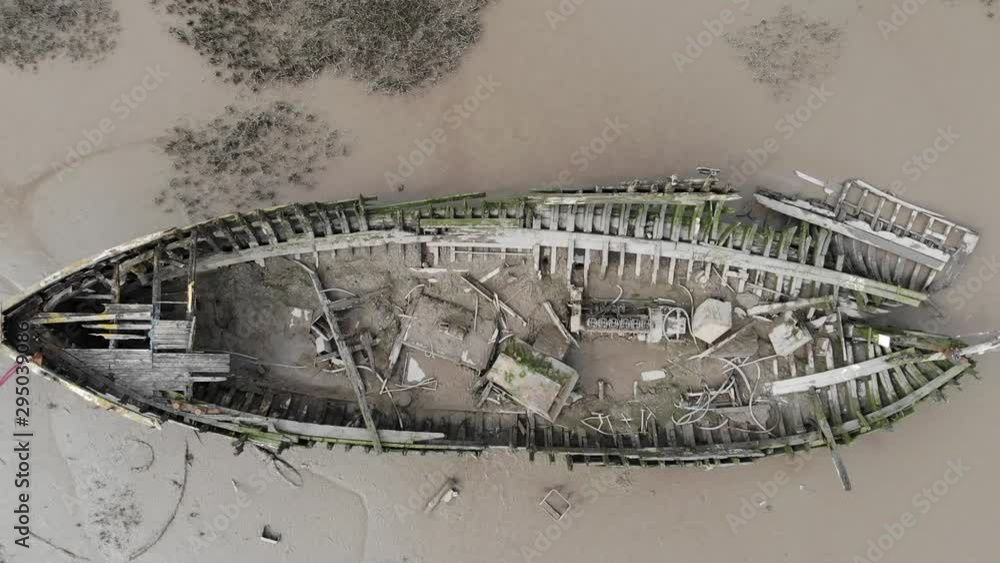 ship wreck from above slowly rising upwards with exposed wood and metal ...