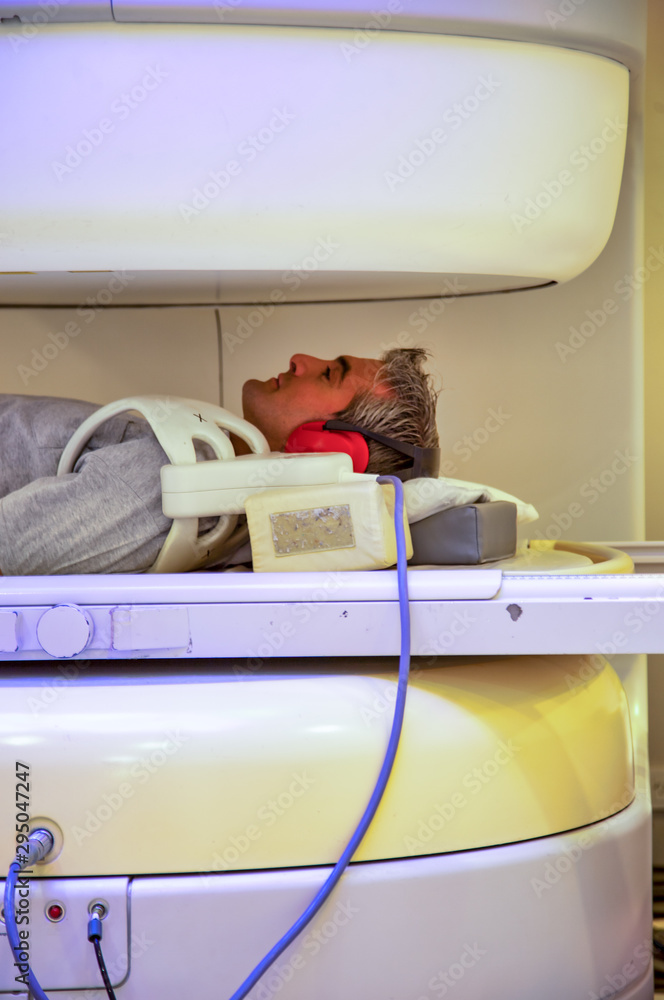 Man undergoing open MRI scan at hospital Stock Photo | Adobe Stock