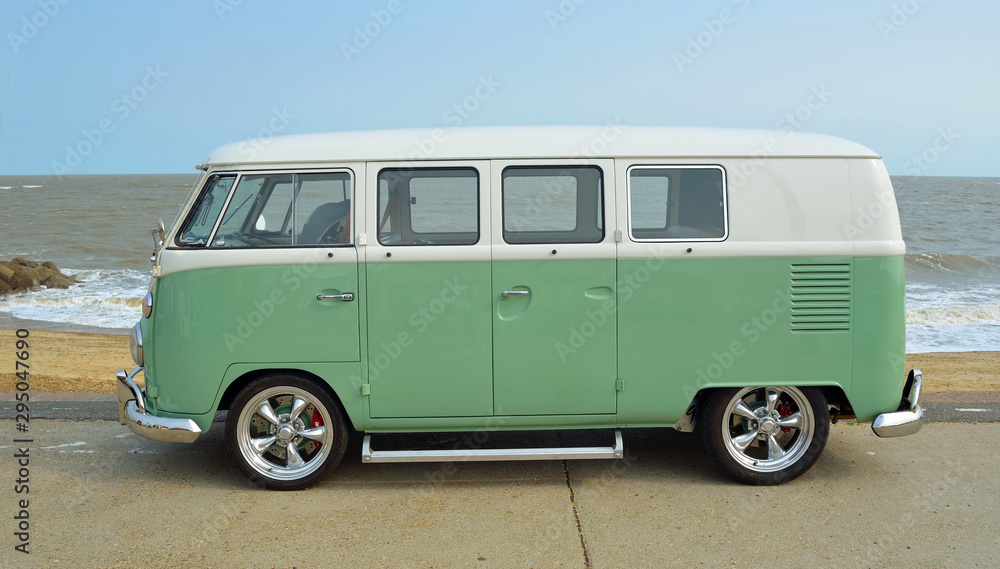 Classic Green and white Camper Van parked on Seafront Promenade. Stock ...