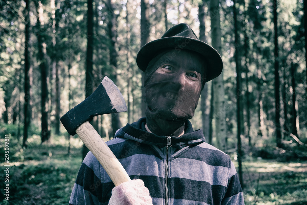 Serial maniac with axe in forest, bloody killer, murderer, mad man in ...