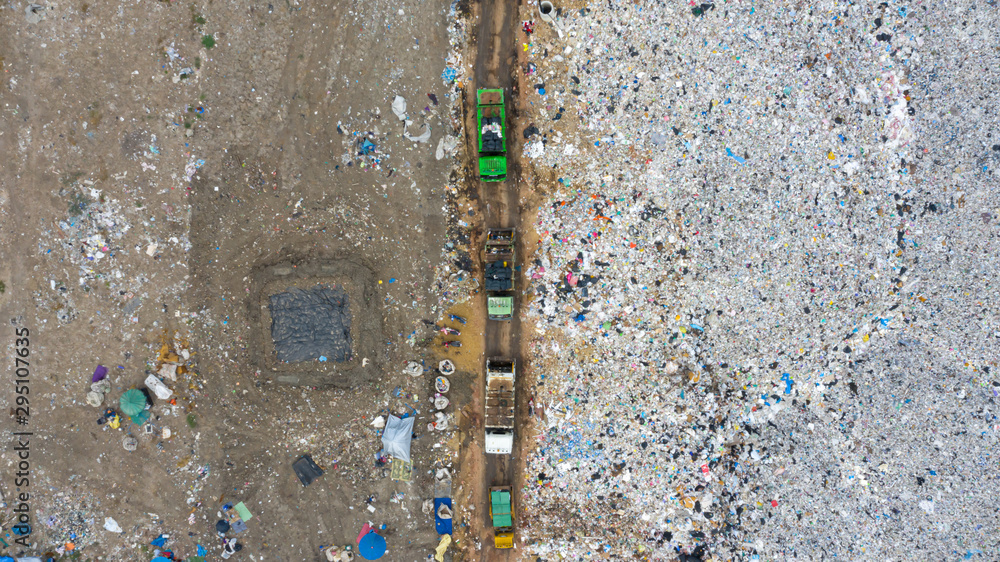 Garbage trucks unload garbage to open landfill, Surface and subsurface ...