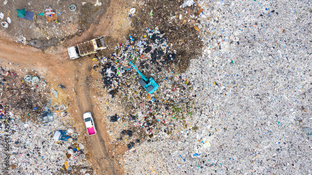 Garbage trucks unload garbage to open landfill, Surface and subsurface ...