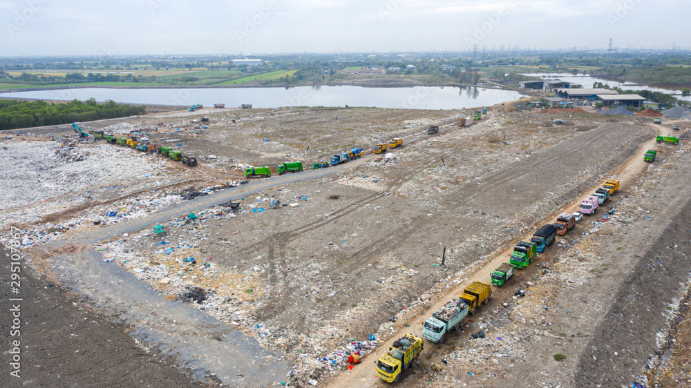 Garbage trucks unload garbage to open landfill, Surface and subsurface ...