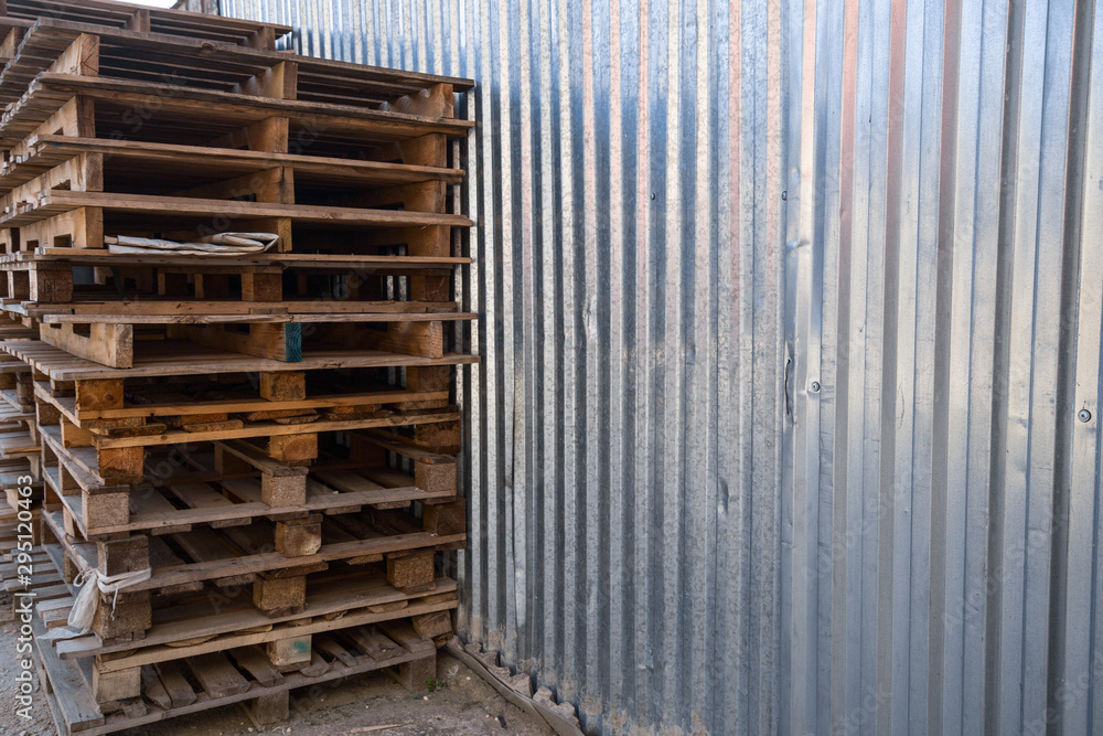 Old wooden pallet and rusty mechanisms in the workshop of an old ...