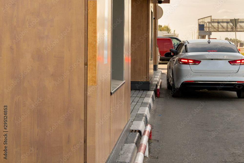 Car near the window of a fast food restaurant. Payment and receipt of ...