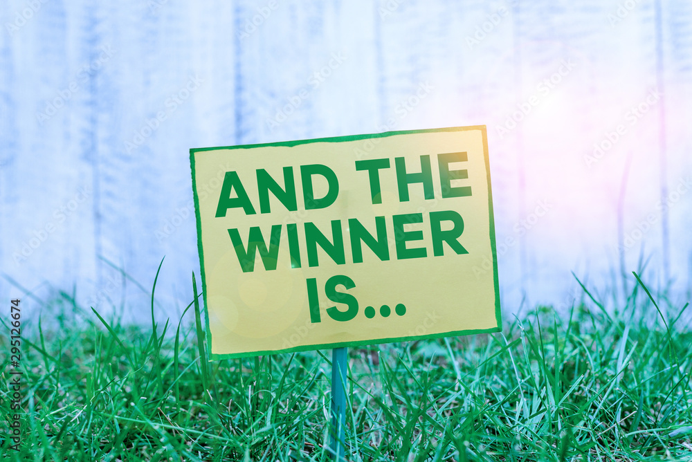 Handwriting text writing And The Winner Is. Conceptual photo announcing ...