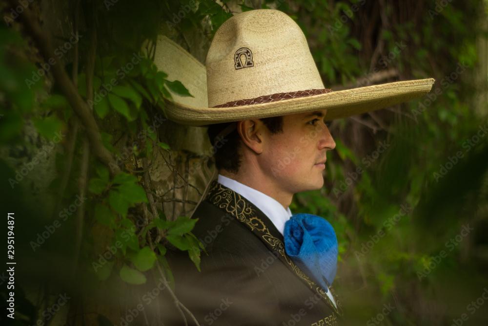 Charro Mexican young man in mariachi suit traditional folk outdoors ...
