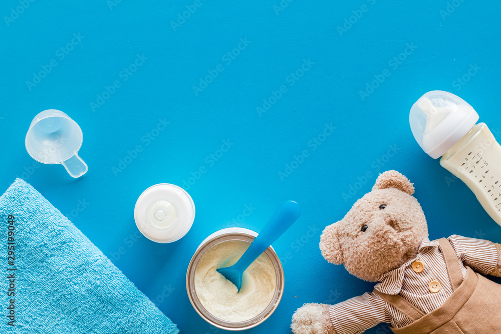 Baby food background with toys and accessories on blue table top view ...