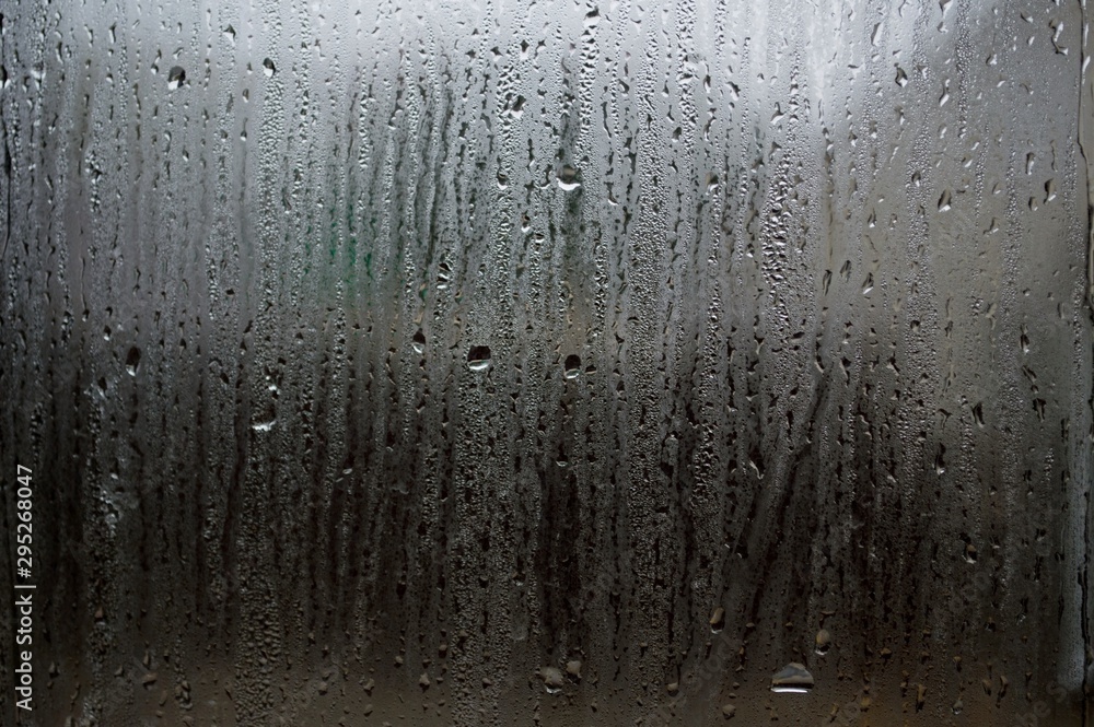 Fog and raindrops on window glass, dark background and lantern l Stock ...