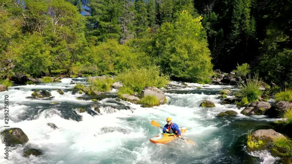 Aerial view of man whitewater kayaking the Mill Creek section of water ...