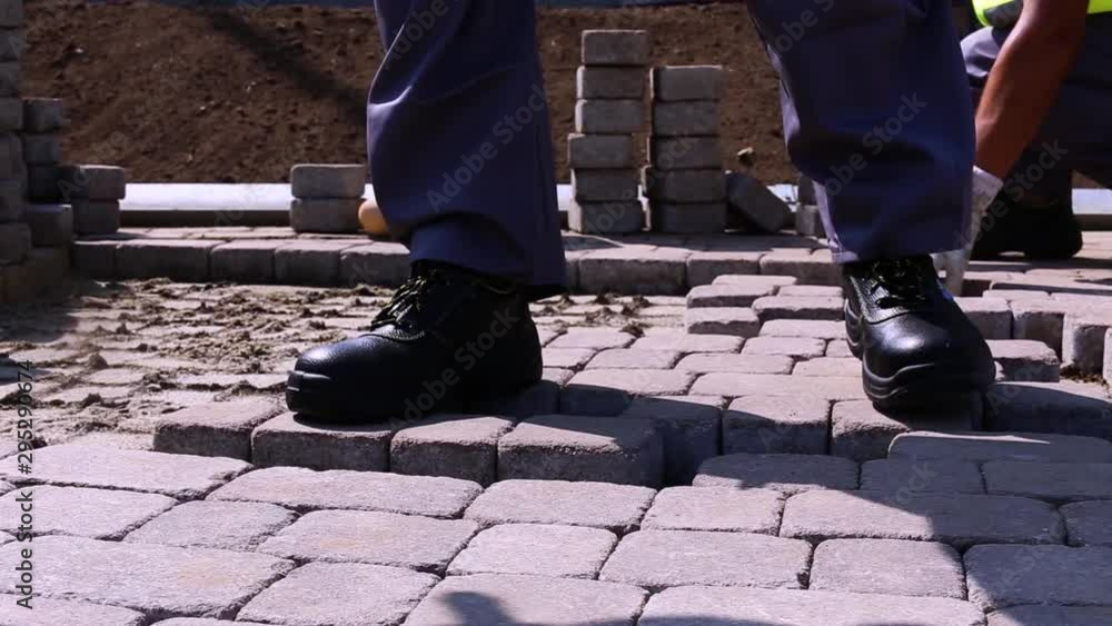 Stone Pavement Road Construction Workers Removing Blocks Using An ...