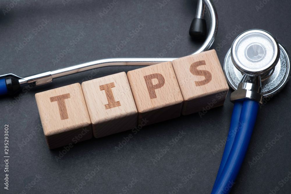 Wooden block form the word TIPS with stethoscope. Medical concept ...