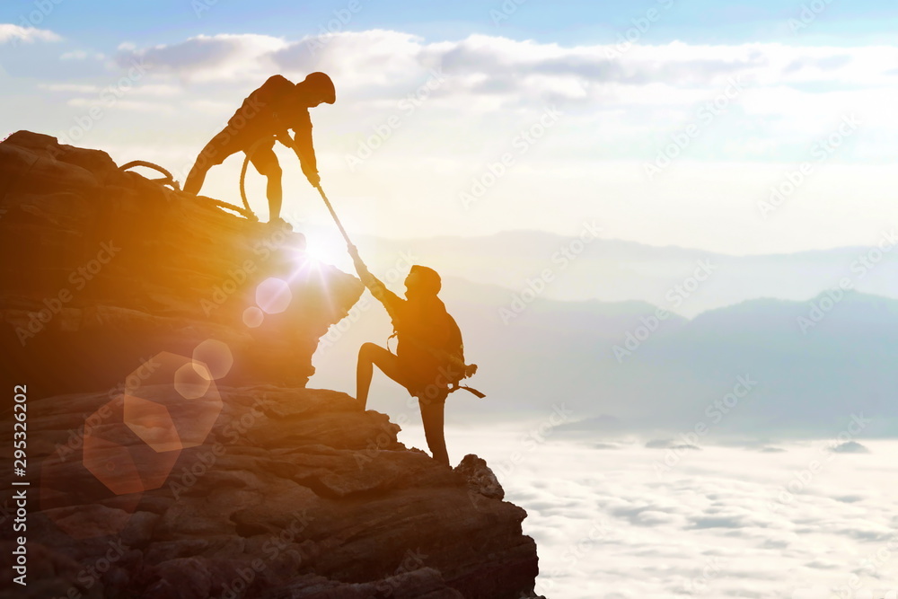 Climbing team are on the climb to the cliff,hiking and team work ...