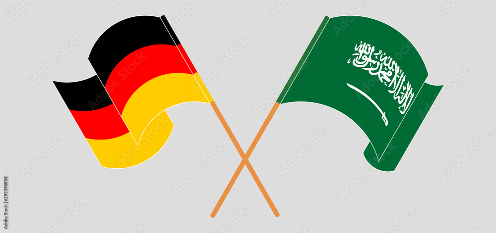 Crossed and waving flags of the Kingdom of Saudi Arabia and Germany ...