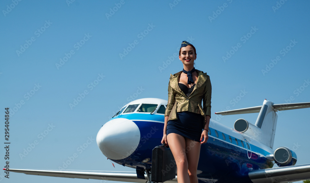 Stewardess and travel time. Portrait of smiling flight attendant ...