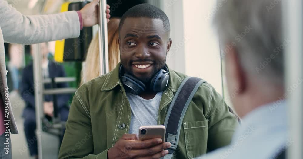 Young African American happy smiled polite guy standing up as conceding ...