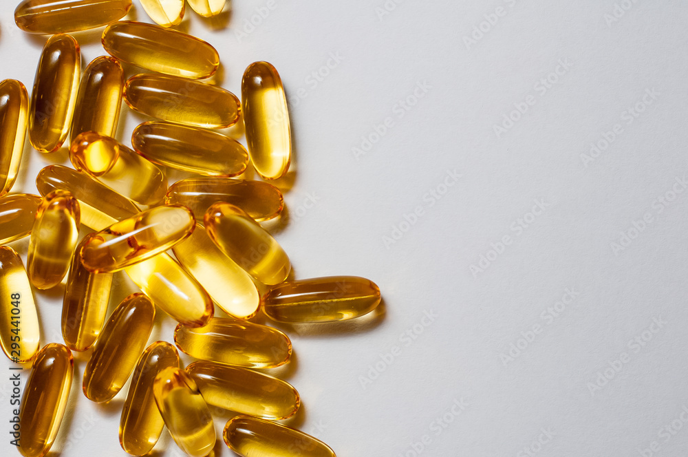 Close up of food supplement oil filled capsules suitable for: fish oil ...
