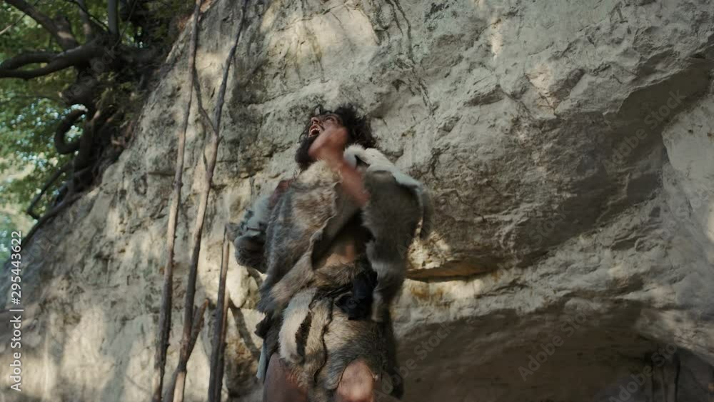 Portrait of Primeval Caveman Wearing Animal Skin Does Aggressive Chest ...